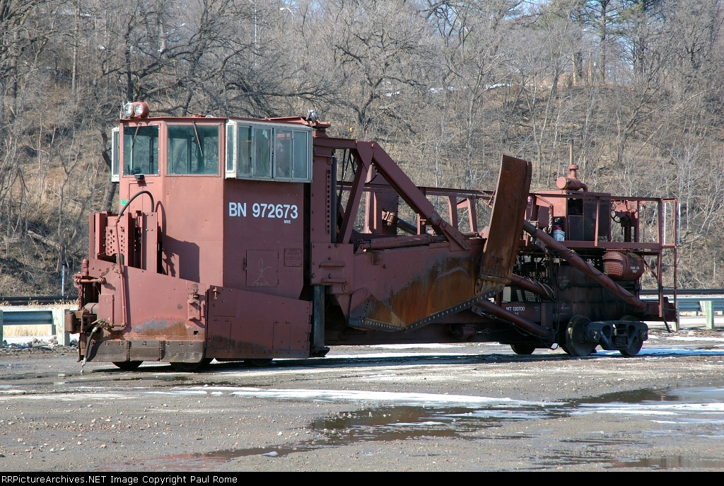 BN 972673, Jordan spreader, at the BNSF's Gibson Yard